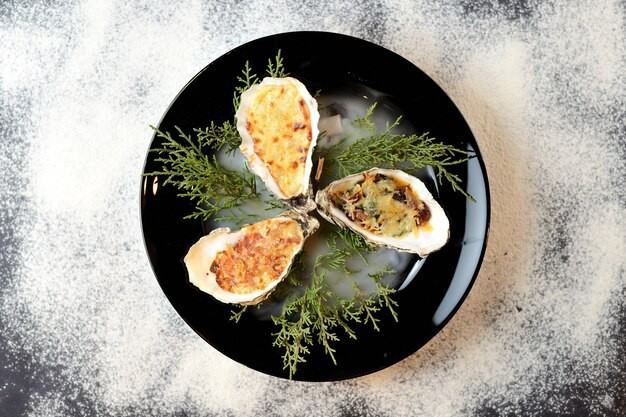 7 Sensational Ways to Dress Up Your Cooked Oysters on the Half Shell