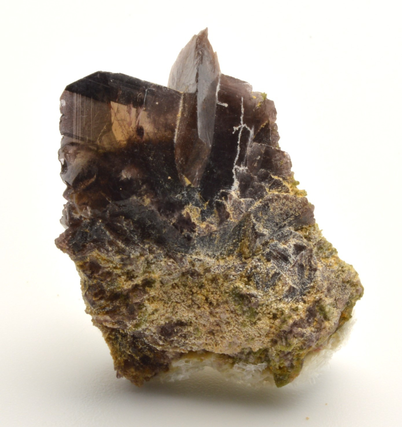 Axinite: Magnetism and Color