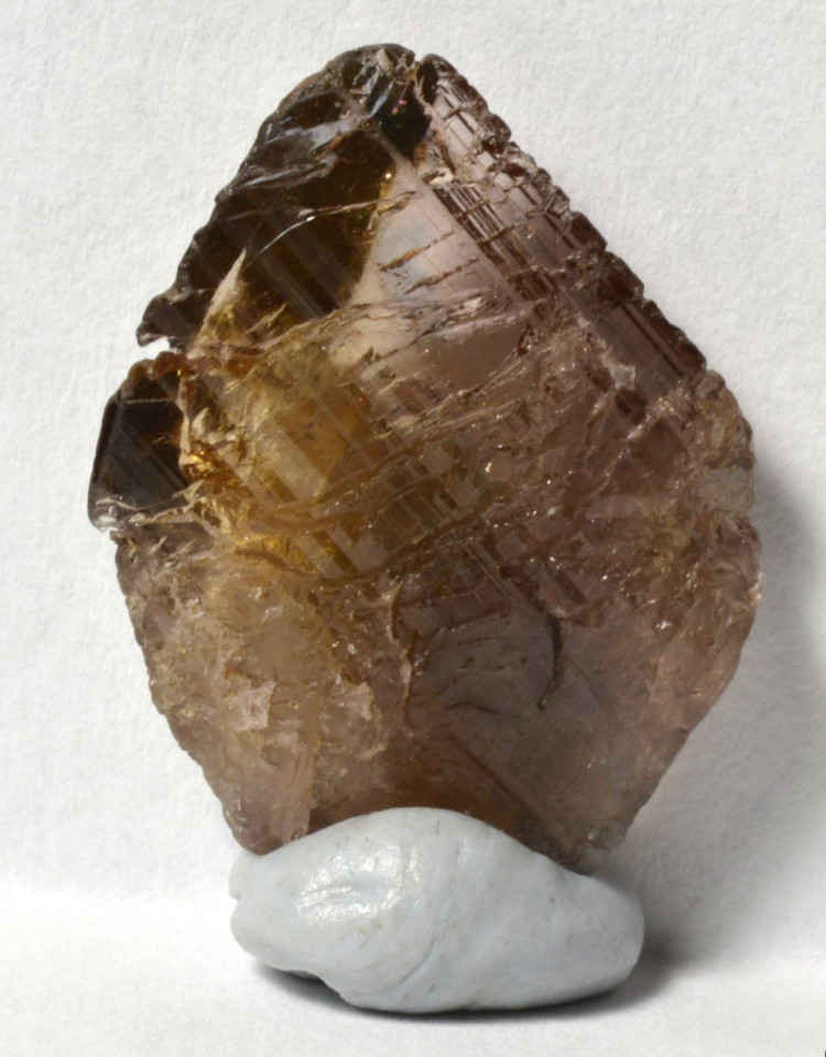 Axinite: Magnetism and Color