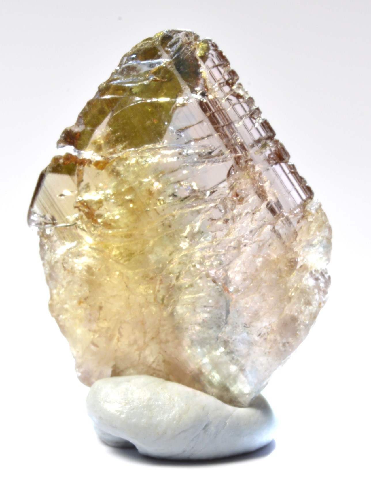 Axinite: Magnetism and Color