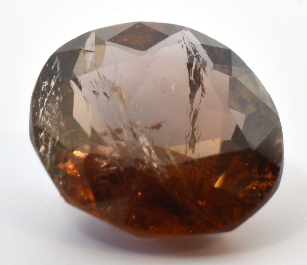 Axinite: Magnetism and Color