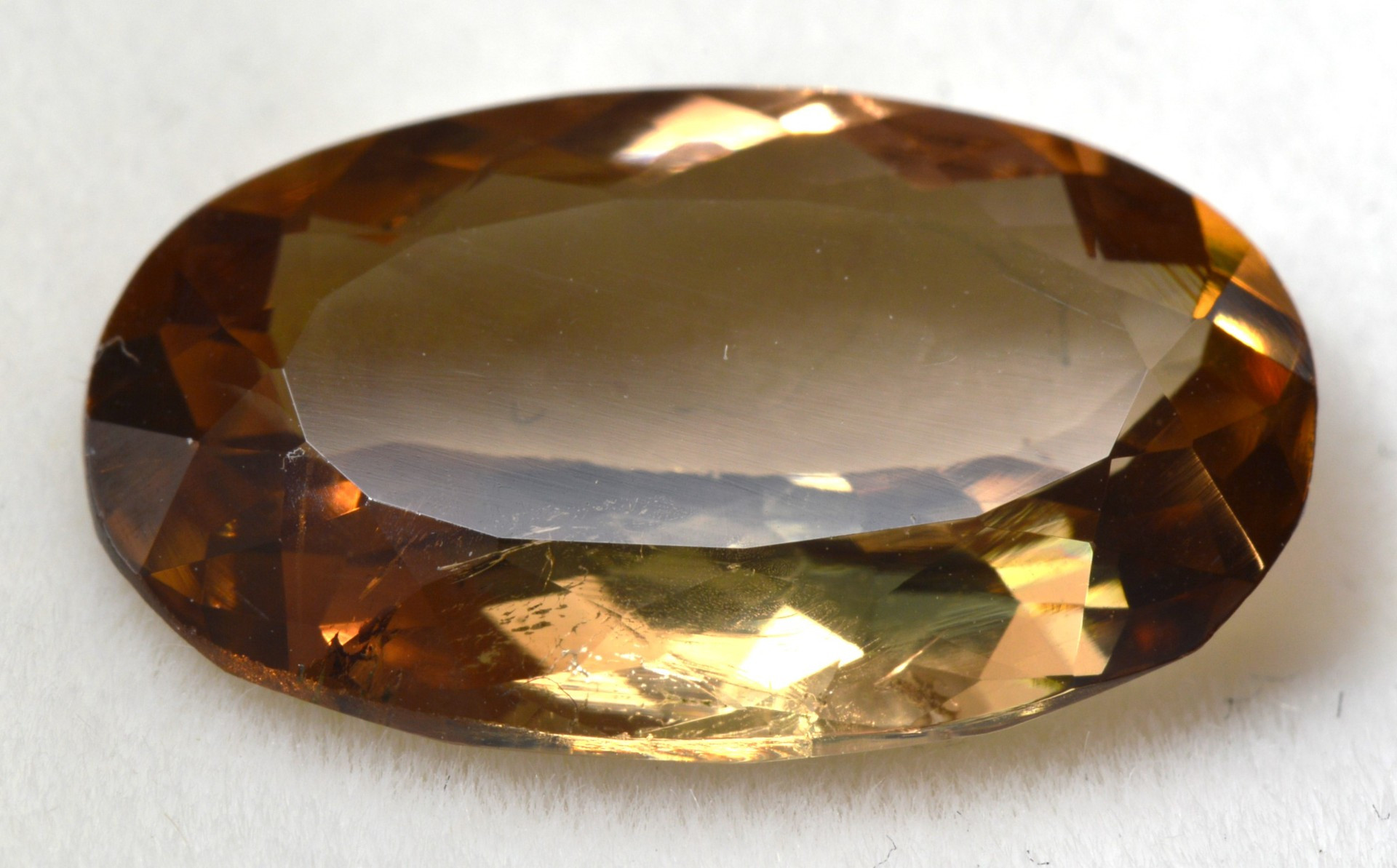 Axinite: Magnetism and Color